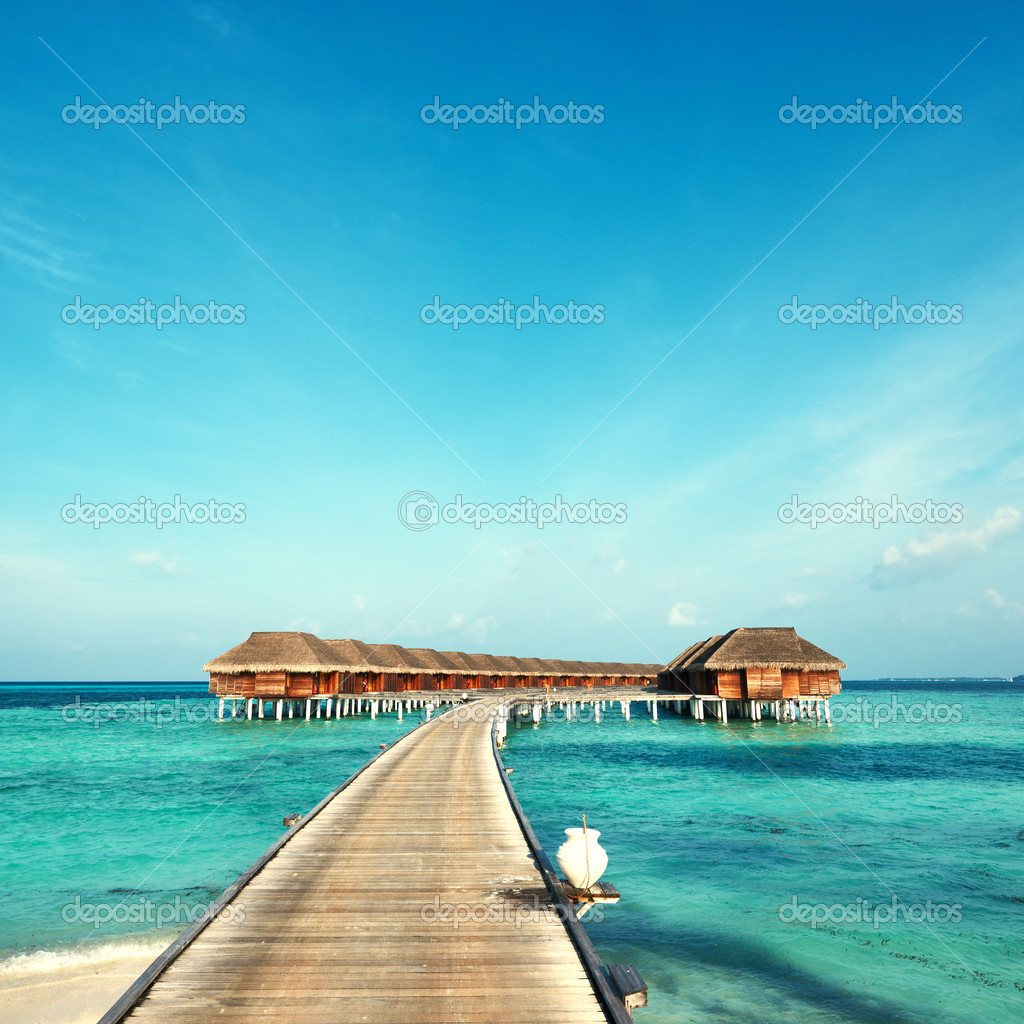 Beautiful beach with water bungalows — Stock Photo © haveseen #39849155