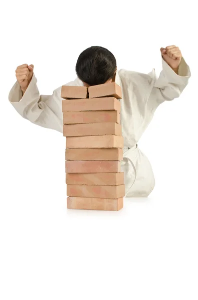Woman karate breaking bricks on white Stock Photo by ©Elnur_ 12025651