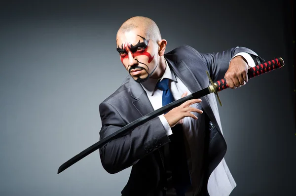Man with face paint and sword - Stock Image - Everypixel