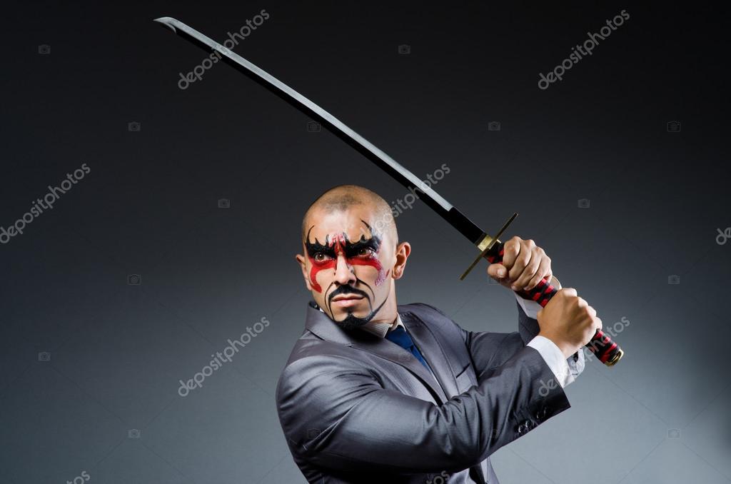 Man with face paint and sword Stock Photo by ©Elnur_ 31141409