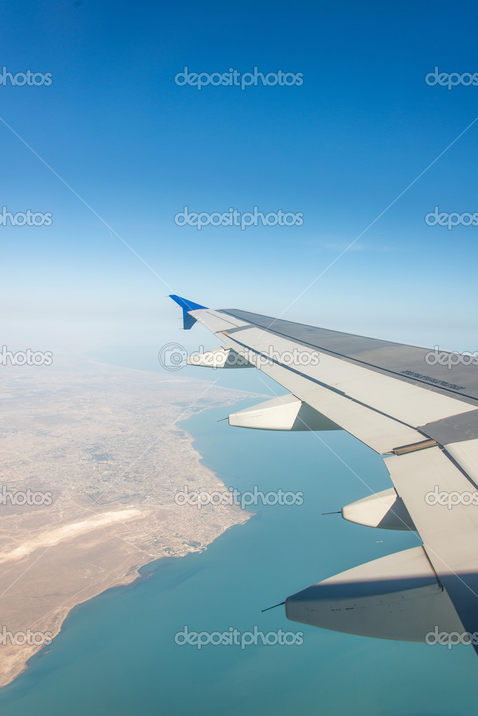Airplane wing out of window — Stock Photo © Elnur_ #50897755