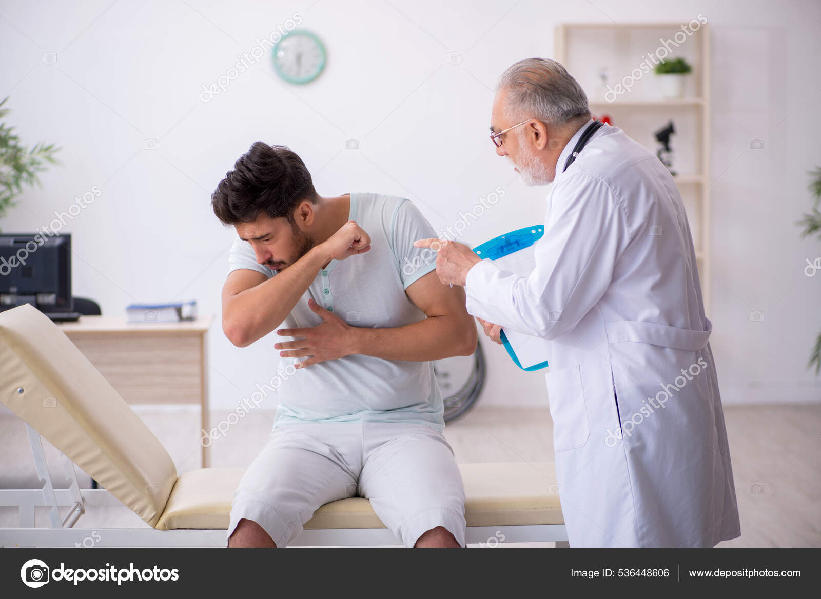 Young male patient visiting old male doctor Stock Photo by ©Elnur ...