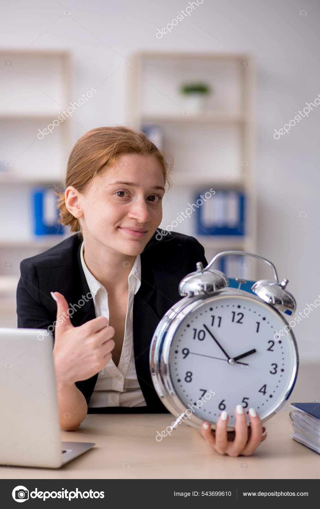 Young female employee in time management concept — Stock Photo © Elnur ...