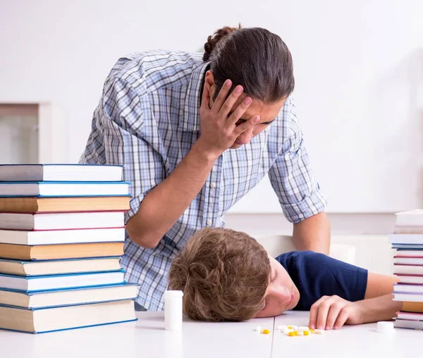 The young student stressed due to excessive studies - Stock Image ...
