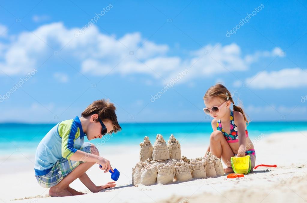Two kids playing at beach — Stock Photo © shalamov #22112623