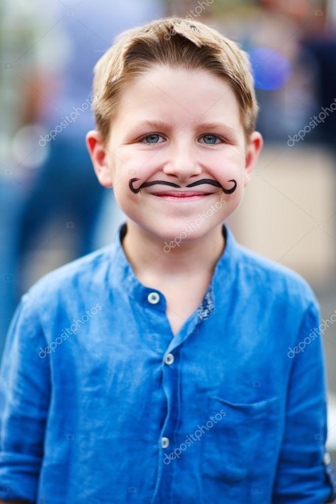 Cute boy with painted mustache Stock Photo by ©shalamov 32360605