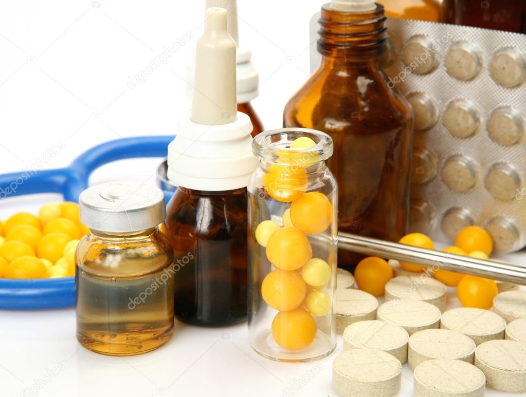 Tablets for treatment of illness Stock Photo by ©Elena777 21270845