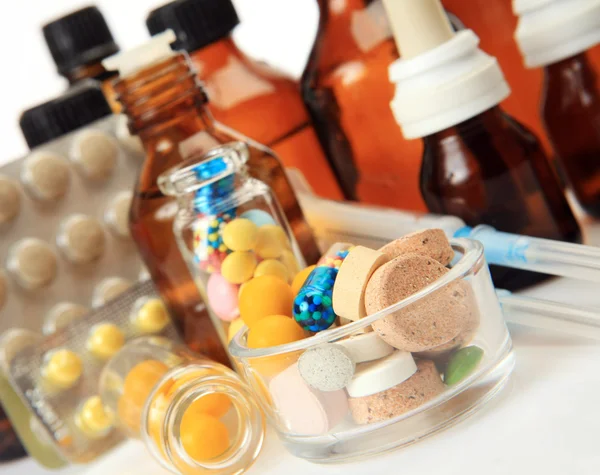 Tablets for treatment of illness Stock Photo by ©Elena777 21270845