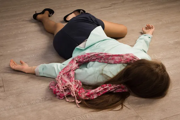 Crime scene simulation. Victim lying on the floor Stock Photo by ...