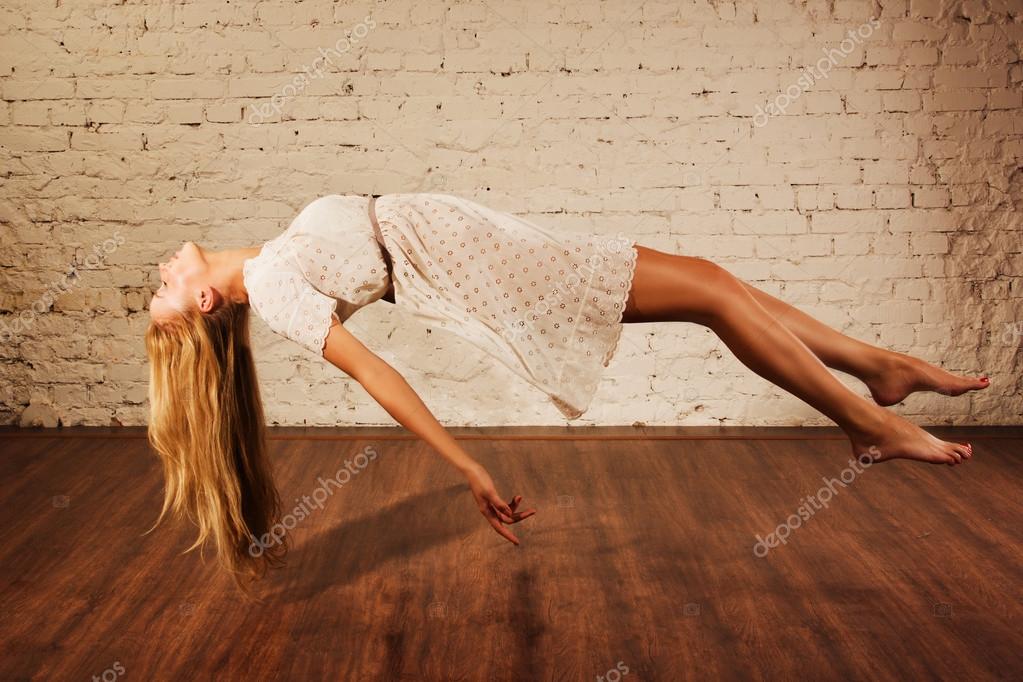 Magic moment - girl levitates — Stock Photo © Demian #32769057