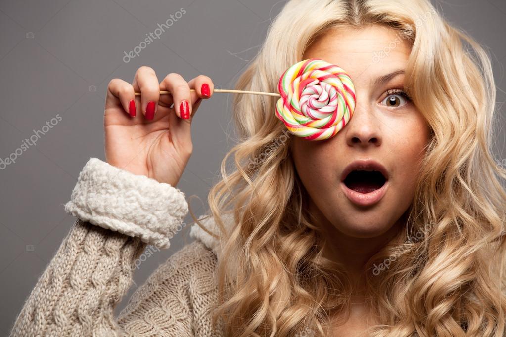 Young woman with candy — Stock Photo © logoff #13929060