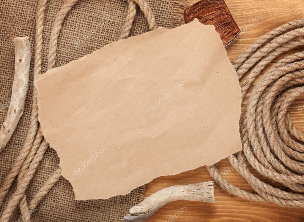 Old paper and rope on wooden textured background — Stock Photo ...