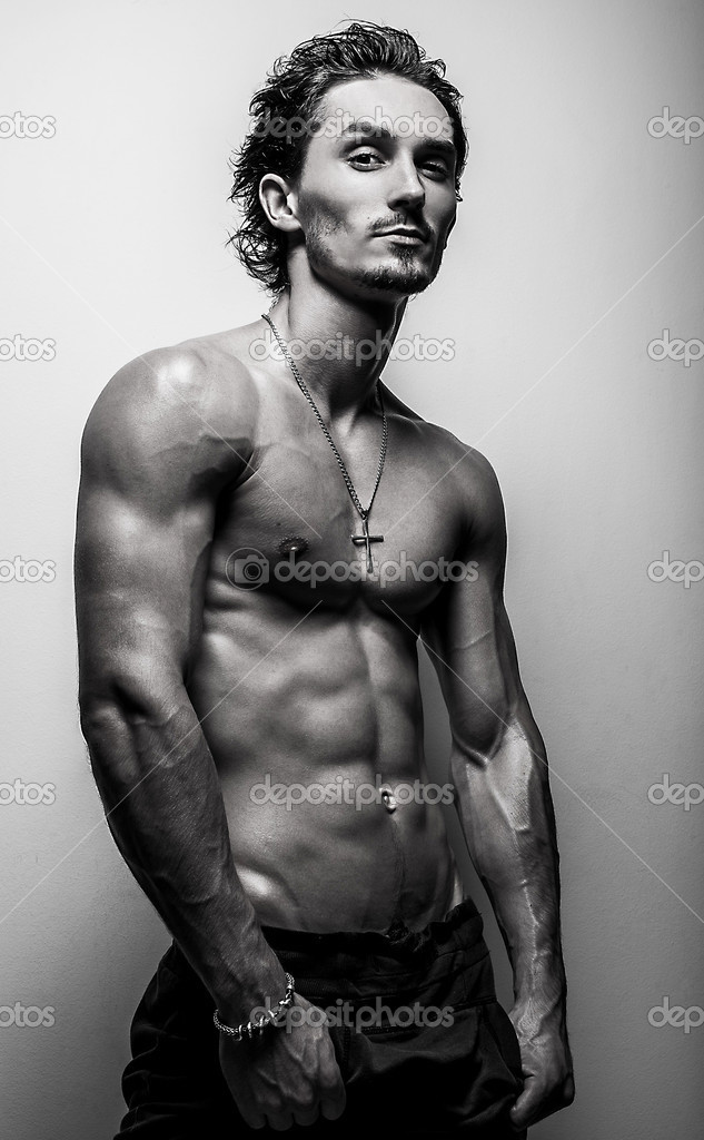 Beautiful and health athletic caucasian muscular young man. Black-white ...
