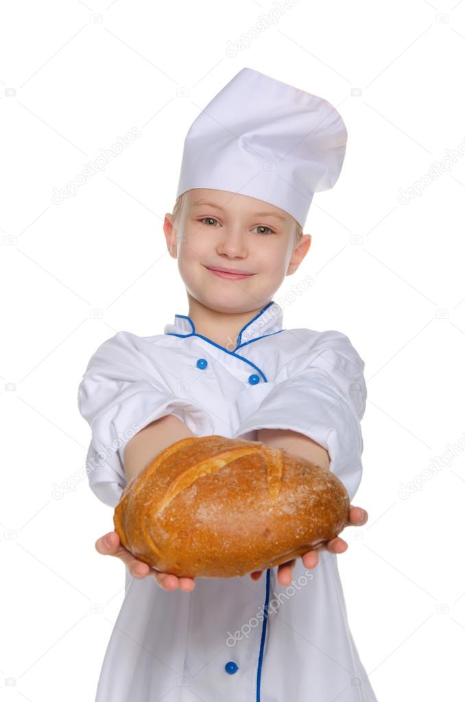Smiling chef with a loaf of bread Stock Photo by ©Zametalov 35811163