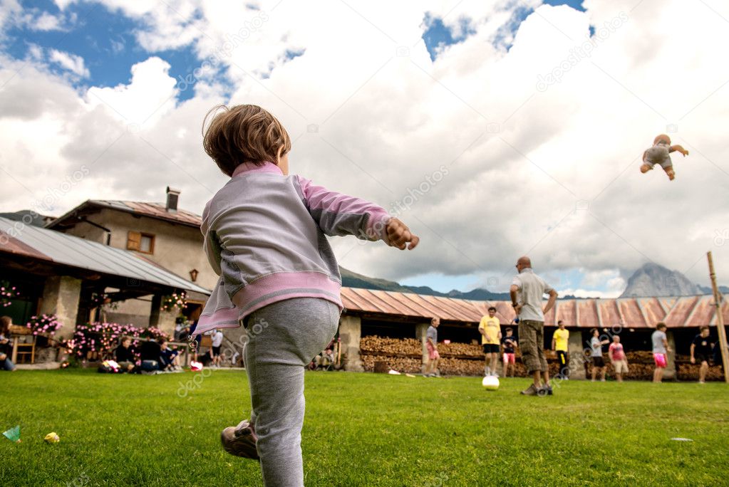 Baby throwing a Doll in the air at a park outdoor — Stock Photo ...