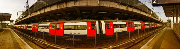 London underground. Long subway train ready to leave the station ...