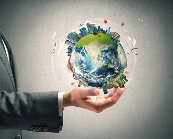 Businessman holds modern World - Stock Image - Everypixel