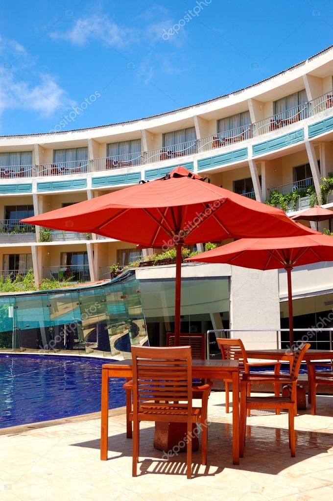 The table and chairs of outdoor restaurant near swimming pool at ...