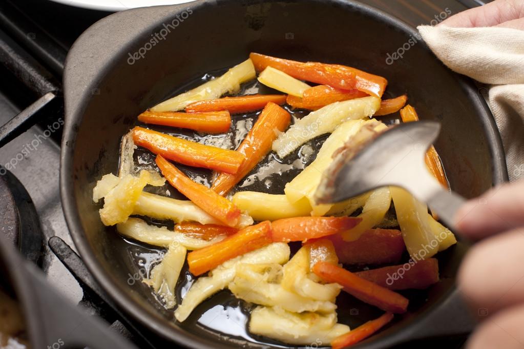Carrot and parsnip batons being sauteed Stock Photo by ©stockarch 41892779