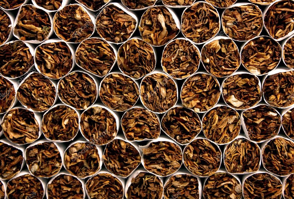 Cigarettes background Stock Photo by ©Valeev 25922573