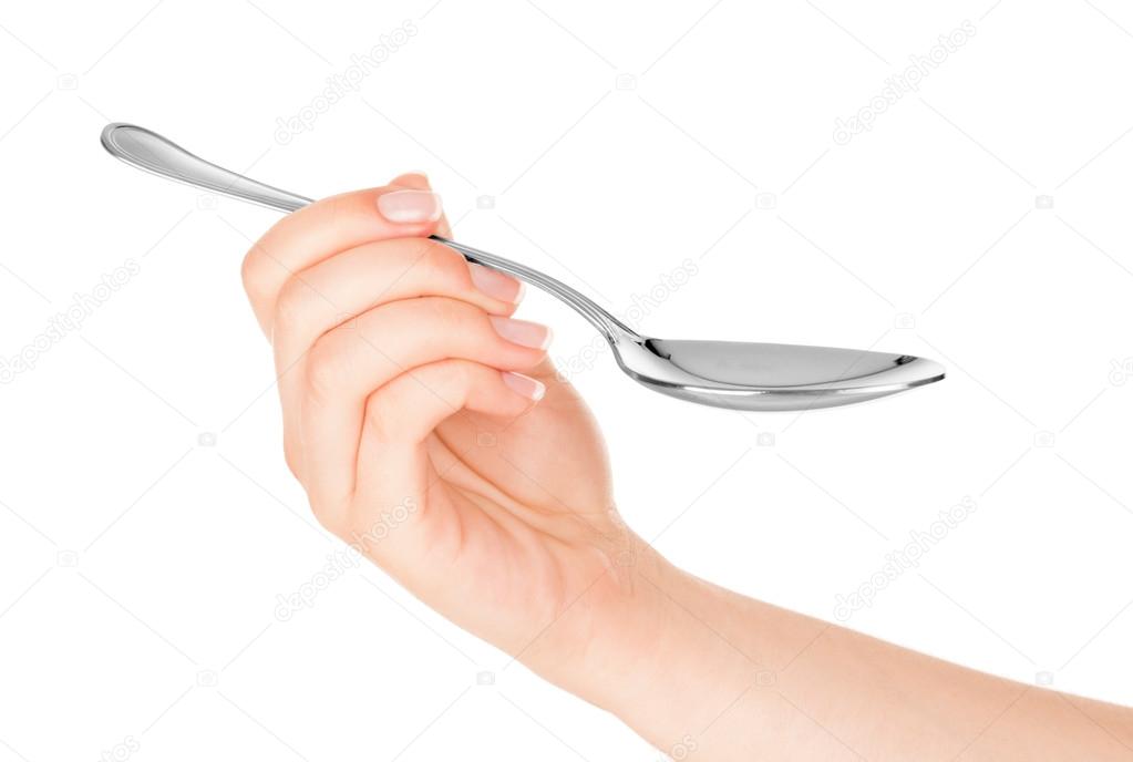 Spoon in hand Stock Photo by ©urfingus 48518611