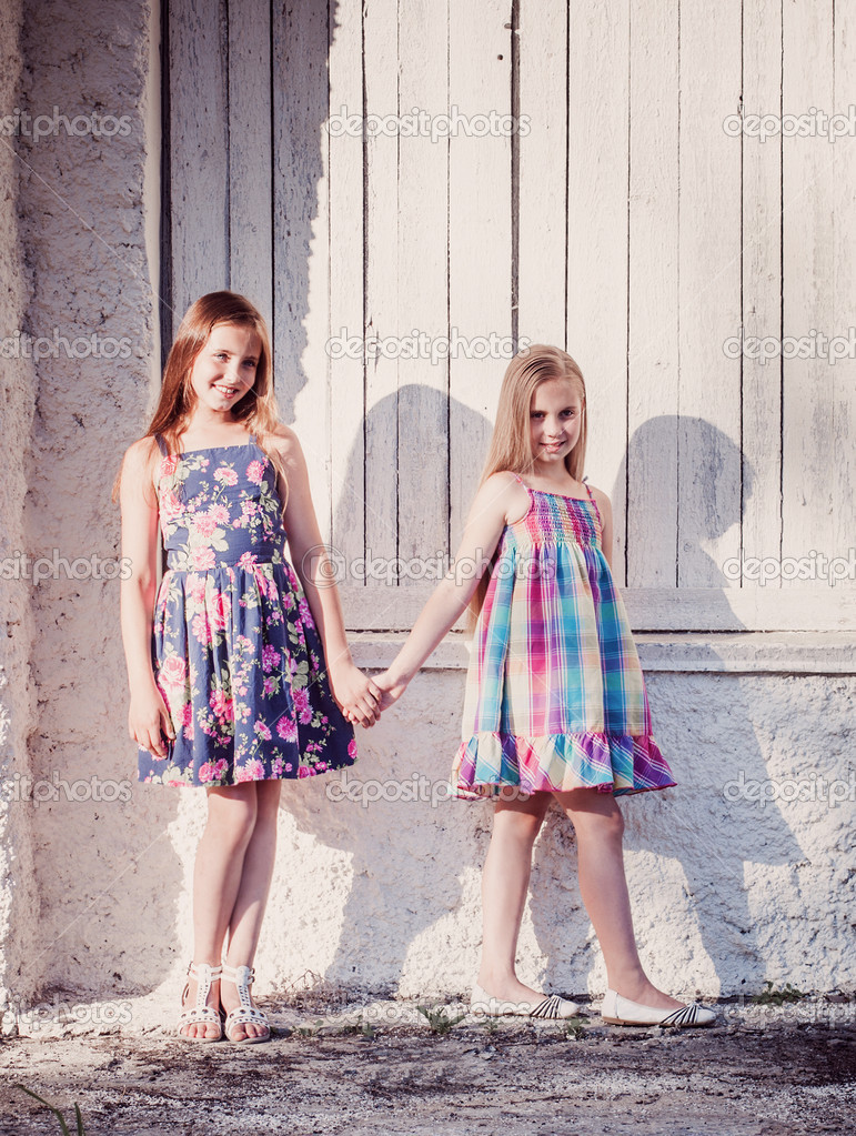 Beautiful girls on background wall Stock Photo by ©Kruchenkova 35773109