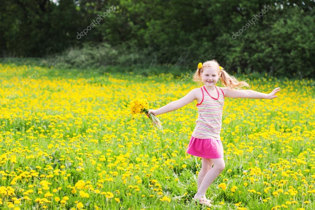 Happy girl with dandelion outdoor — Stock Photo © Kruchenkova #37435701