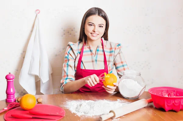 Beautiful girl cooking cake in kitchen Stock Photo by ©Kruchenkova 41678689