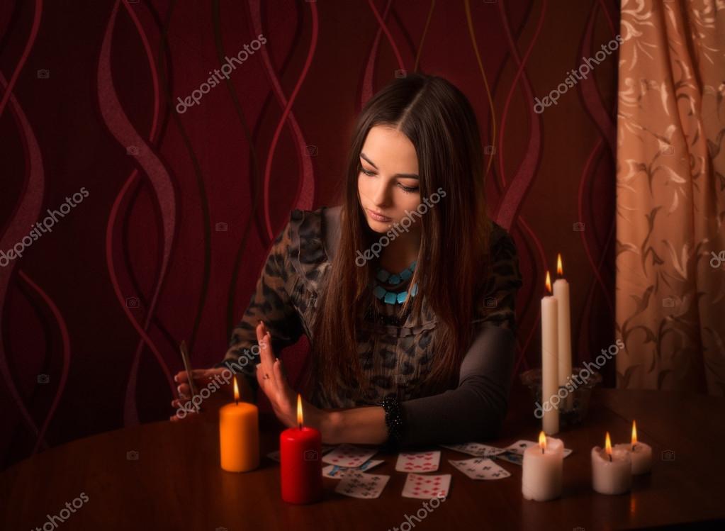 Young woman with divination cards in room — Stock Photo © Kruchenkova ...