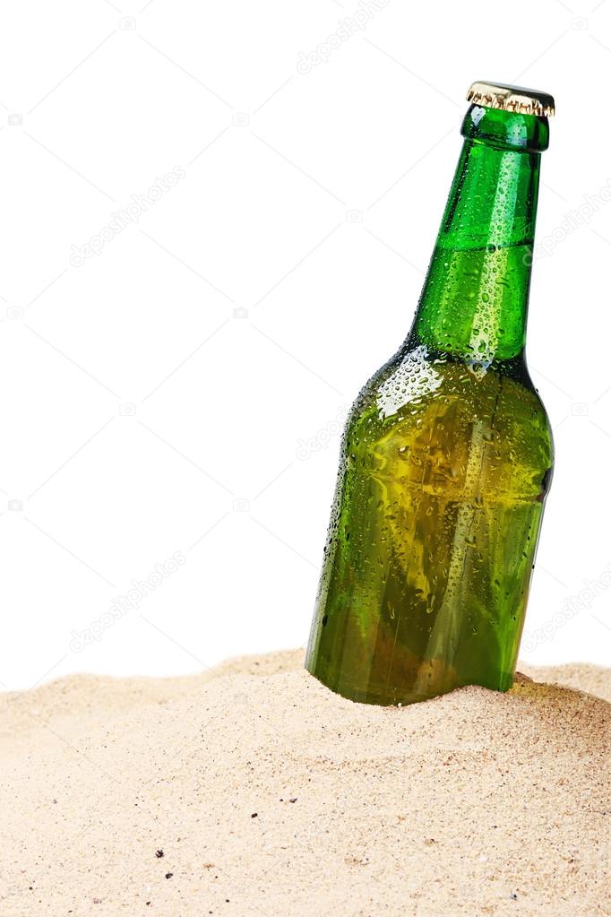 Beer bottle on a sandy Stock Photo by ©doroshin 46147681