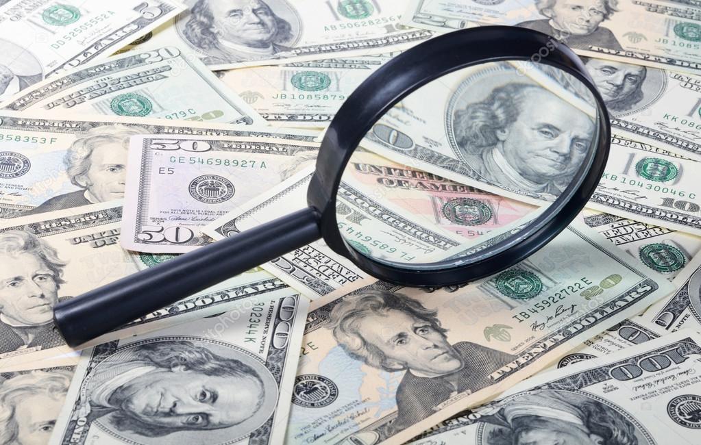 Magnifying glass lying on banknotes Stock Photo by ©voronin-76 12939702