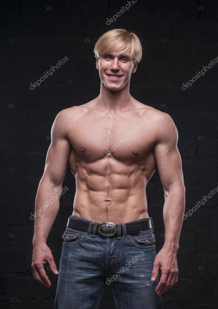 Fit male model in studio Stock Photo by ©vishstudio 32696805