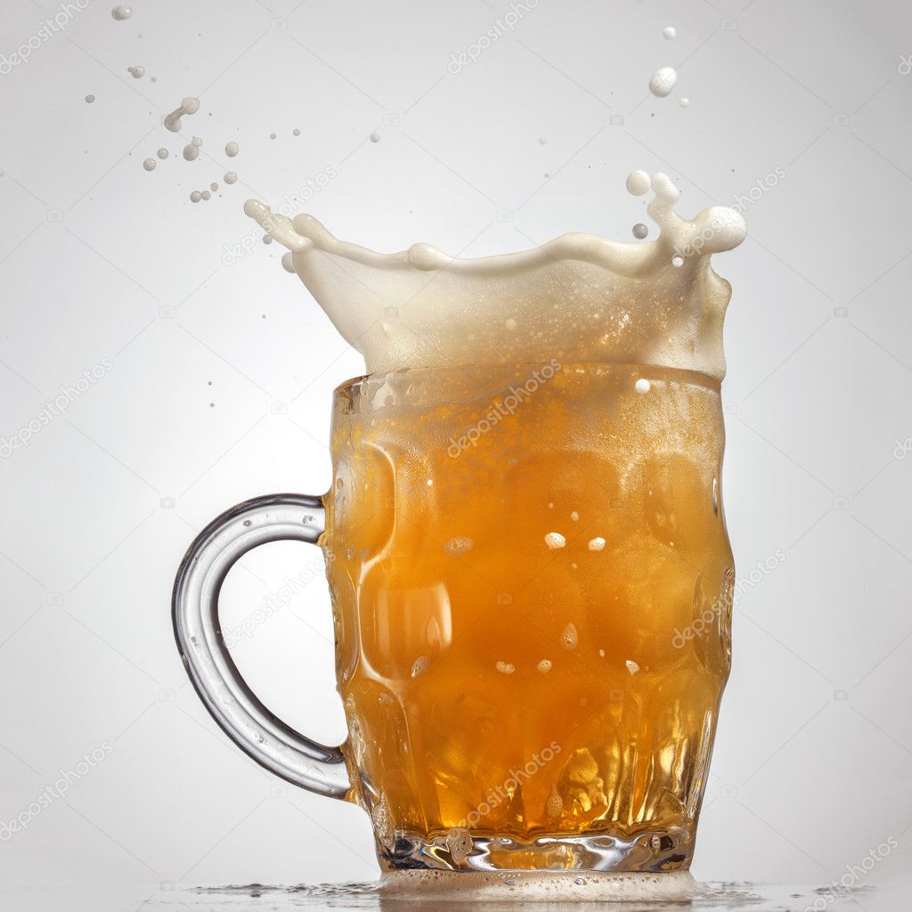 Beer splash in glass isolated on white Stock Photo by ©artjazz 49813561