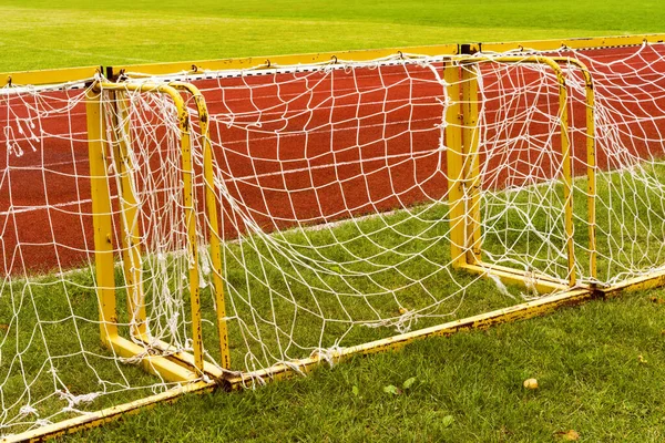 Football in net goal Stock Photos, Royalty Free Football in net goal ...