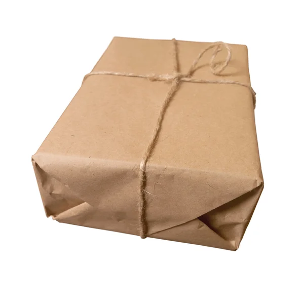Parcel wrapped with brown paper tied with rope isolated on white ...