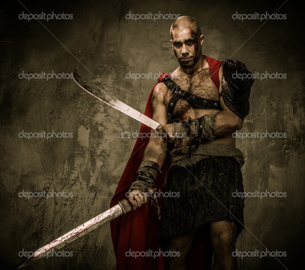 Wounded gladiator with two swords covered in blood Stock Photo by ...