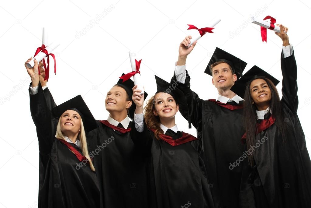 Multi ethnic group of graduated young students isolated on white Stock ...