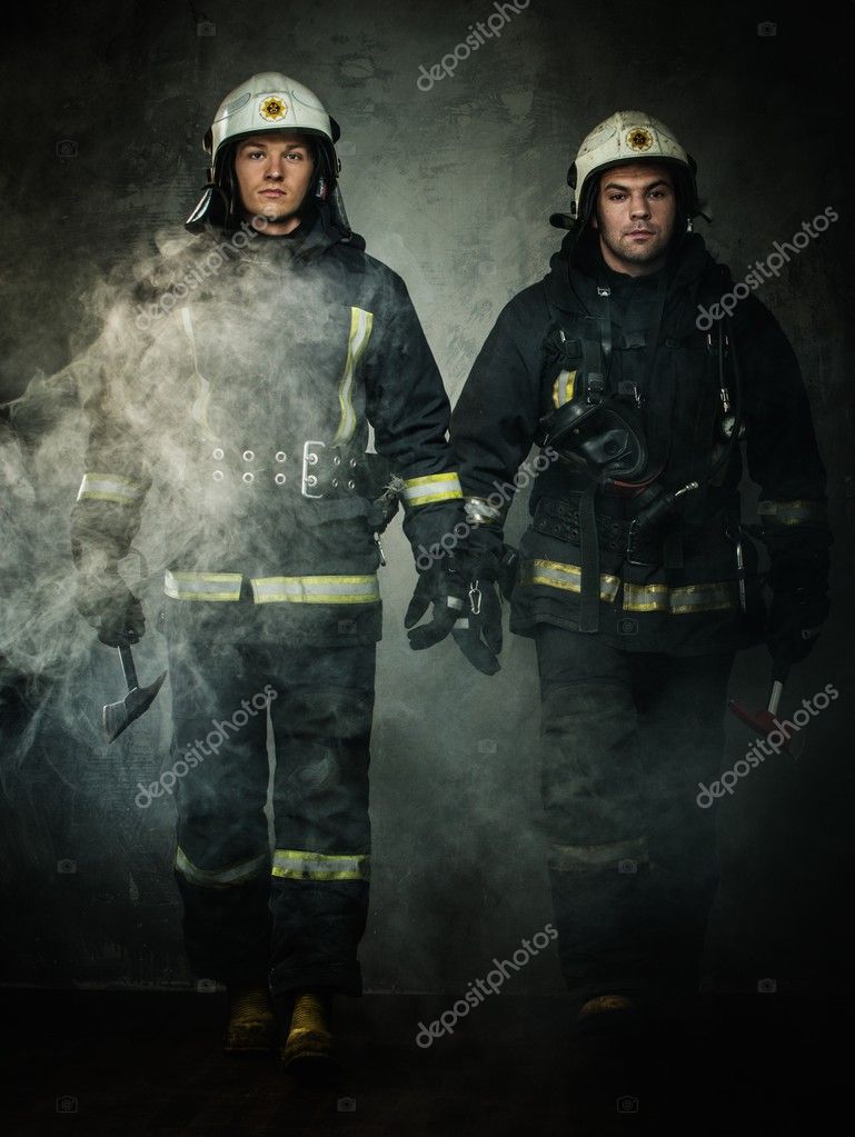 Two firefighters with axes in a smoke — Stock Photo © nejron #47742649