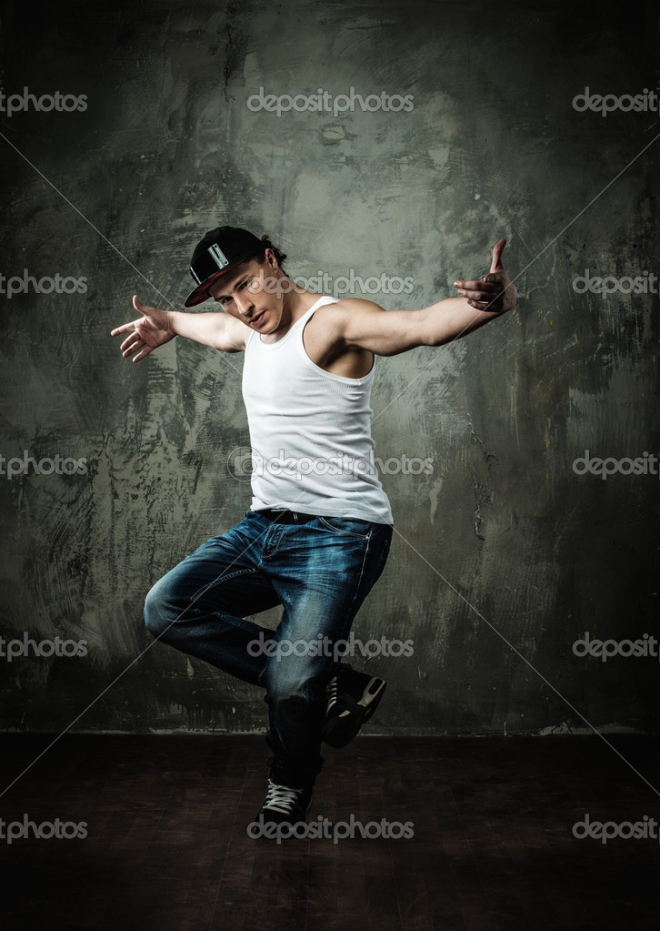 Man dancer showing break-dancing moves Stock Photo by ©nejron 47742797