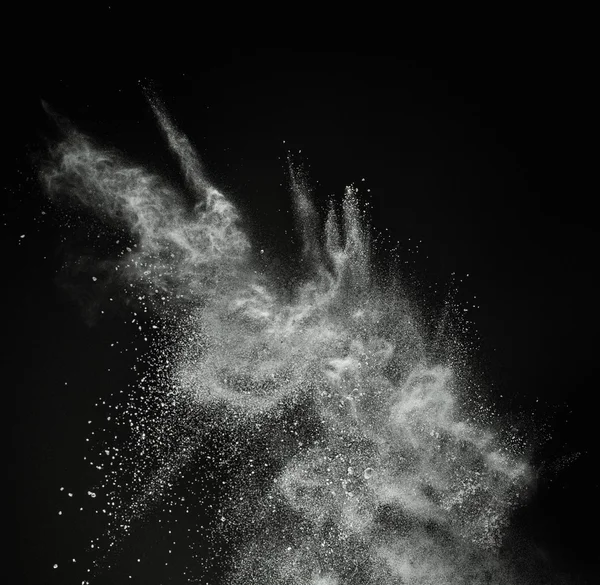 White powder exploding isolated on black — Stock Photo © nejron #49193543