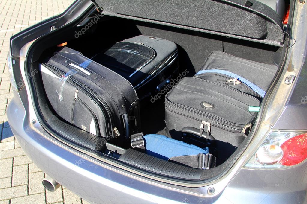 Suitcases in a car luggage carrier — Stock Photo © wolandmaster #12311331