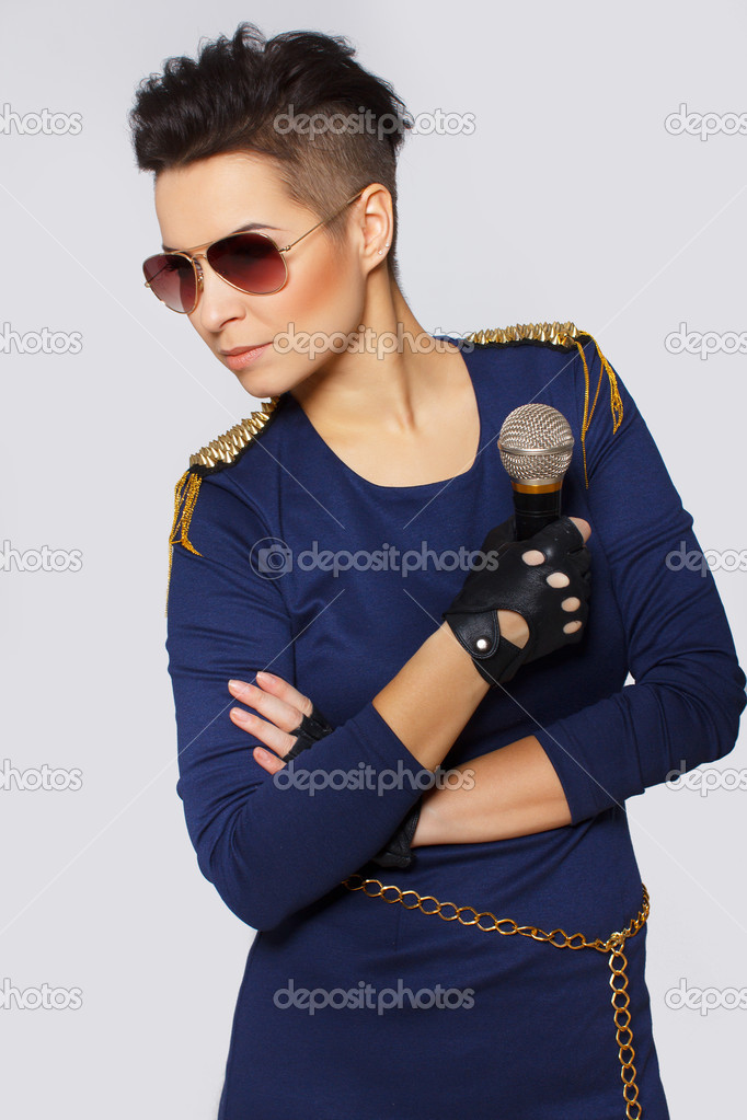 Rock singer with a microphone Stock Photo by ©fxquadro 21702559