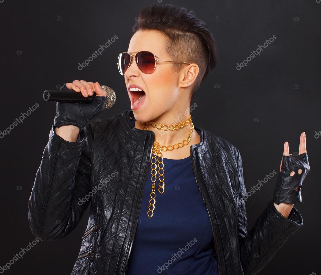 Singing woman is demonstrating rockers gesture Stock Photo by ©fxquadro ...