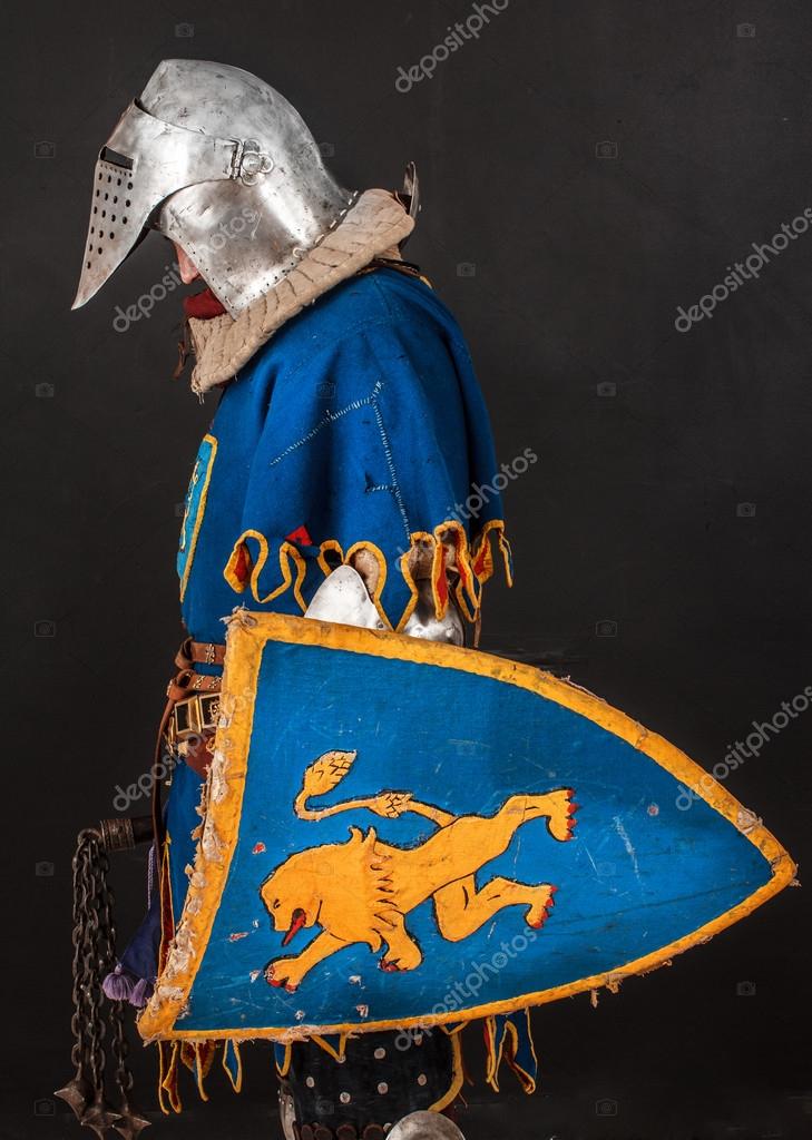 Sad knight with weapon and shield in his hands Stock Photo by ©fxquadro ...