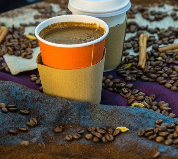 Paper cups with coffee beans — Stock Photo © dedivan1923 #19546109