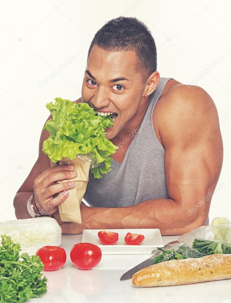 Man eating vegetables Stock Photo by ©fxquadro 43742015