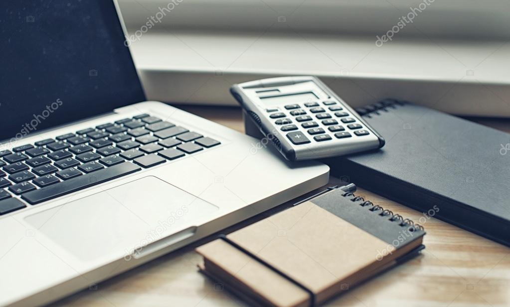 Laptop and notepad Stock Photo by ©fxquadro 45740901
