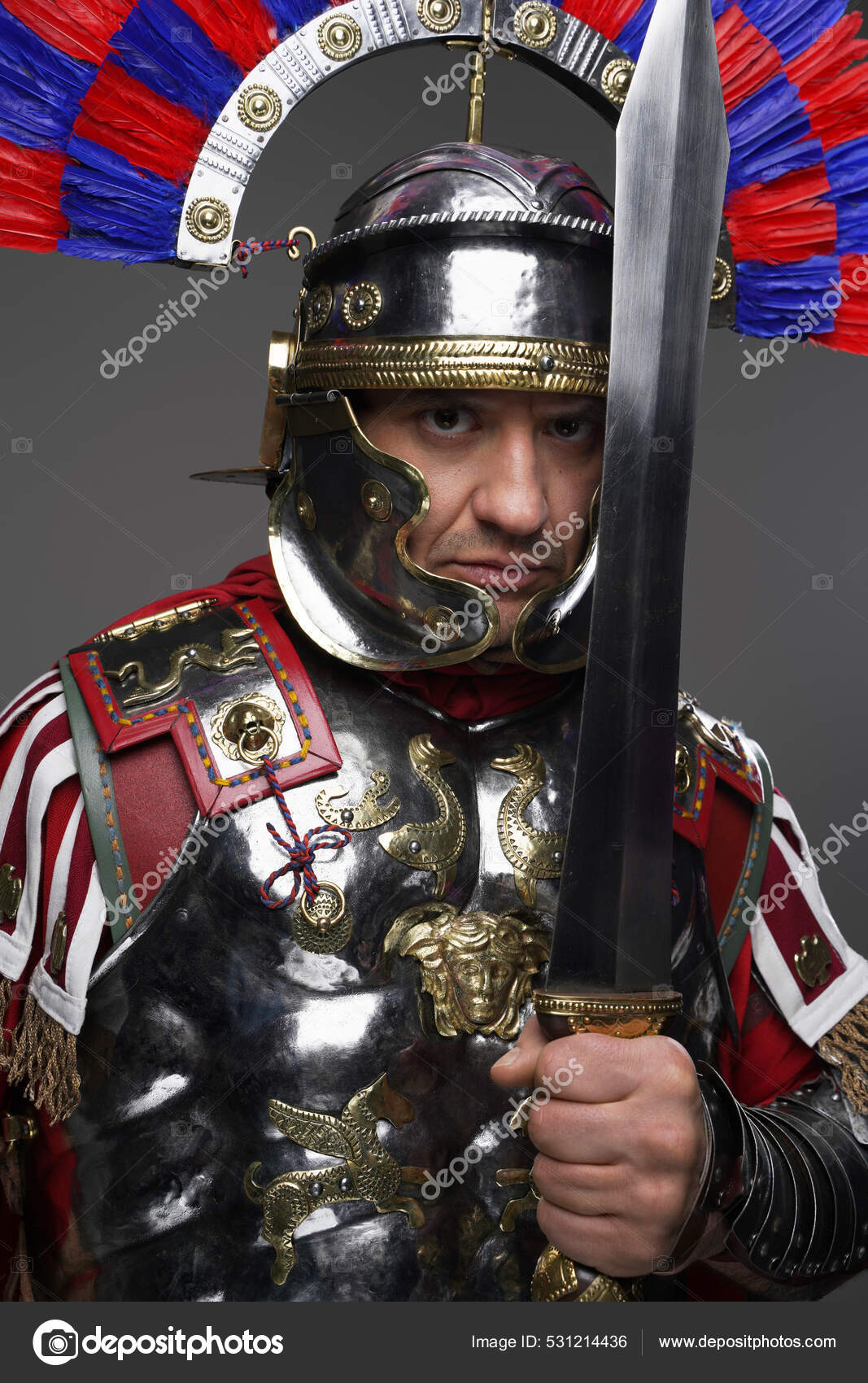 Roman legionnaire posing with sword isolated on gray Stock Photo by ...