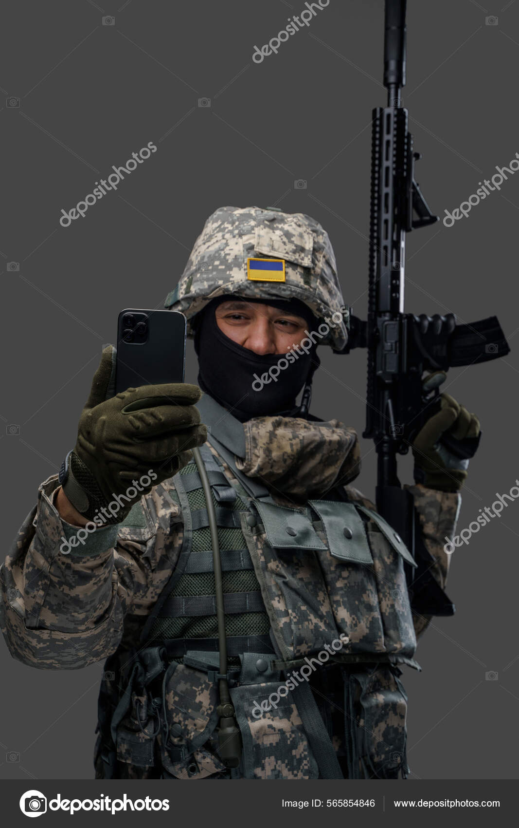 Cheerful military man with rifle and smart phone — Stock Photo ...