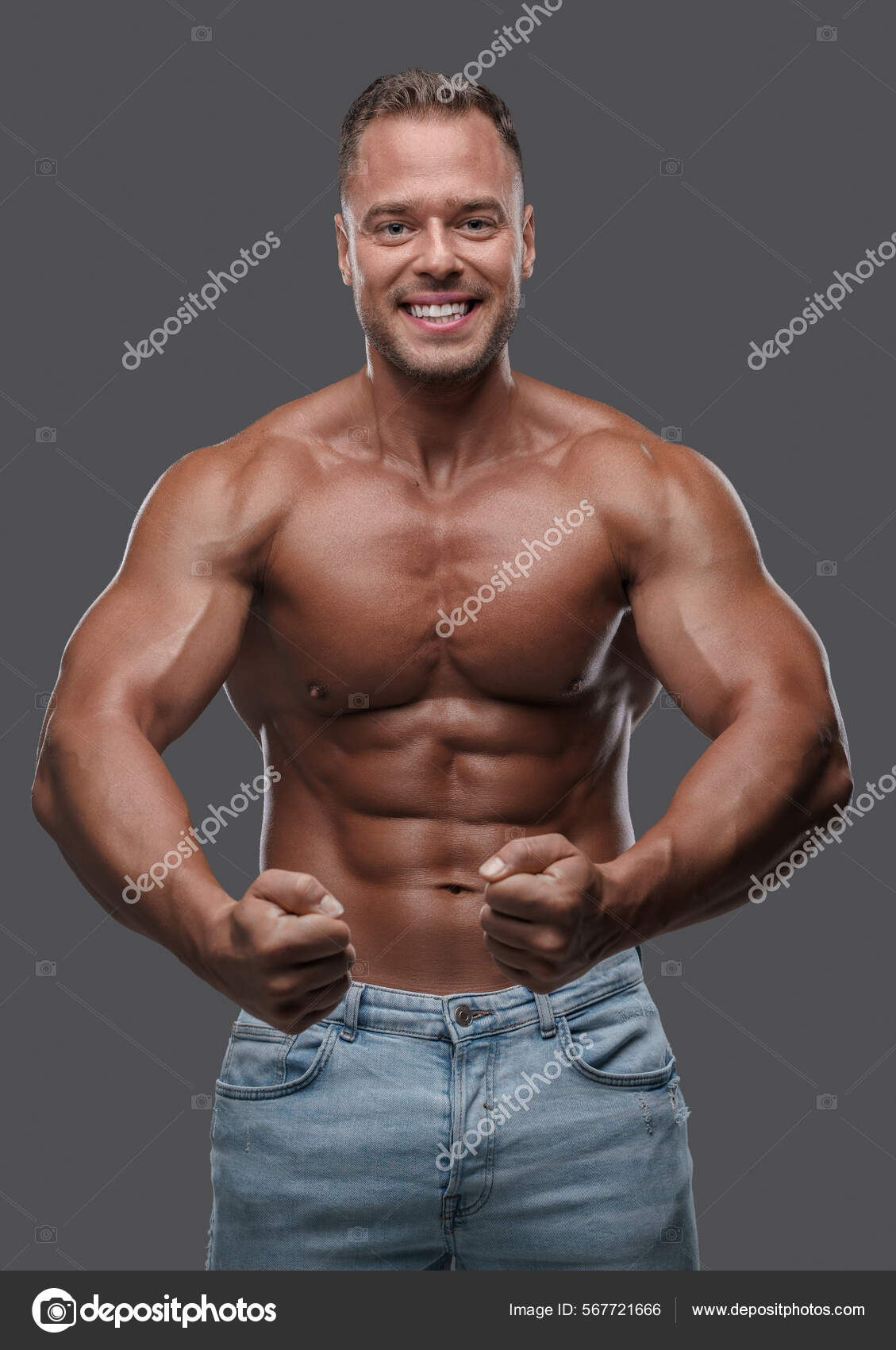 Happy bodybuilder with naked torso posing against gray background Stock ...